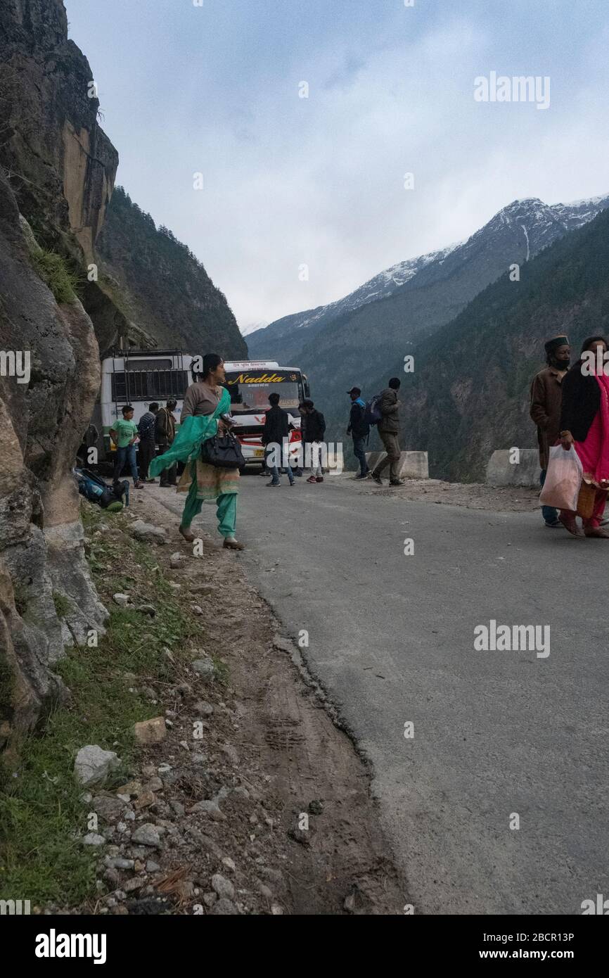 Passengers await for the next bus due to the breakdown of their bus on ...