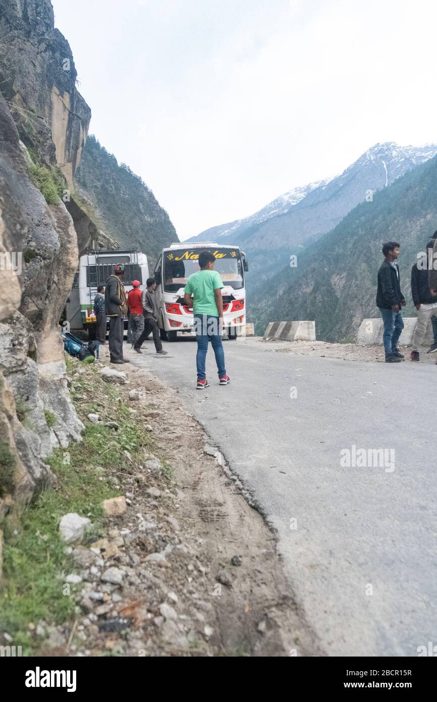 Passengers await for the next bus due to the breakdown of their bus on ...