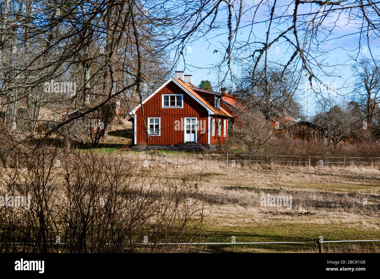 Country landscape, farm, red house, field Stock Photo - Alamy