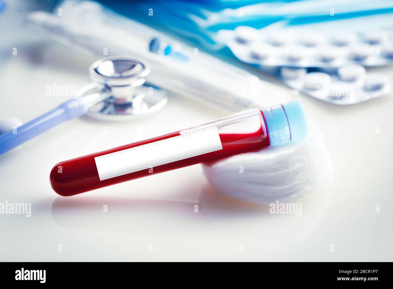 A test tube with a blood test in a medical laboratory. Background with ...