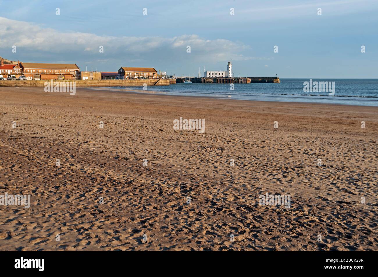 Landscape view of a deserted empty seaside beach in a coastal town with ...