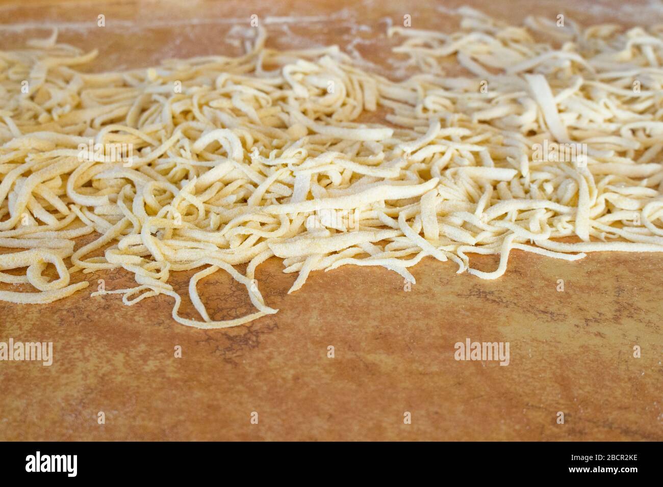 Pasta home making closeup in kitchen interior. The cooking process, raw ...