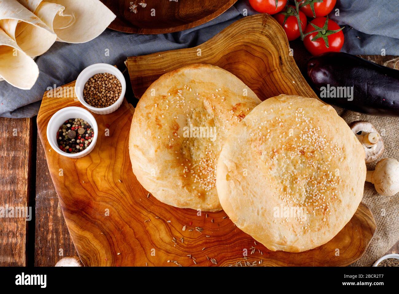 Different types of bread on a wooden Board on a table background Stock ...