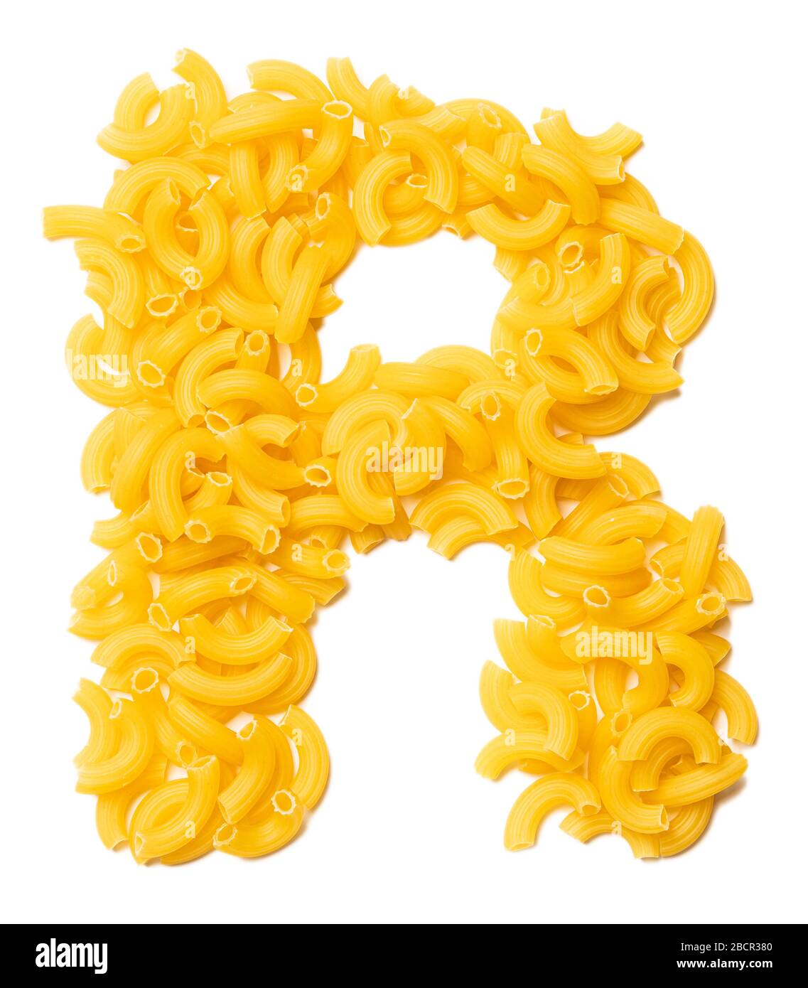 Letter R of the English alphabet from dry pasta on a white isolated ...