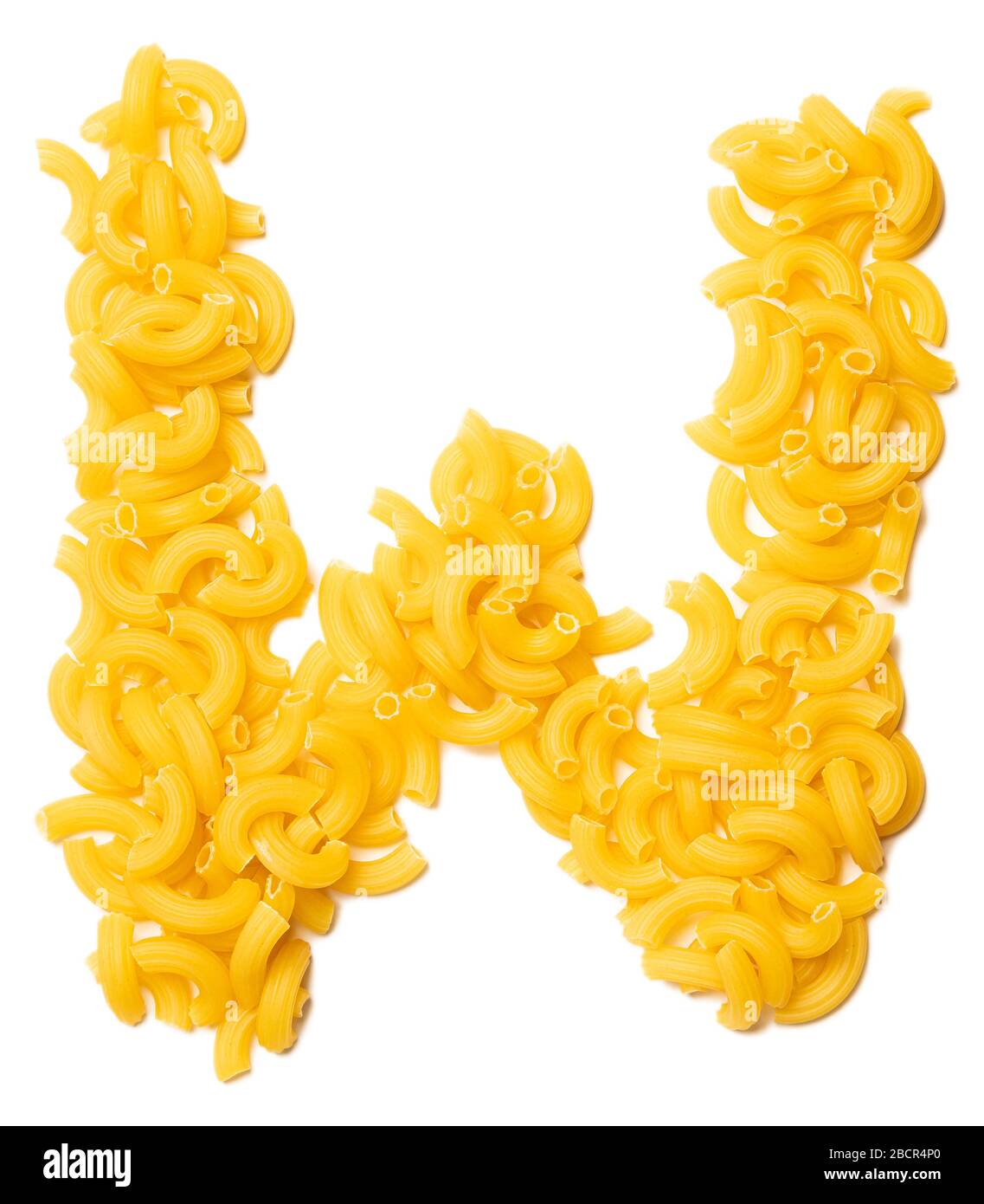 Letter W of the English alphabet from dry pasta on a white isolated ...