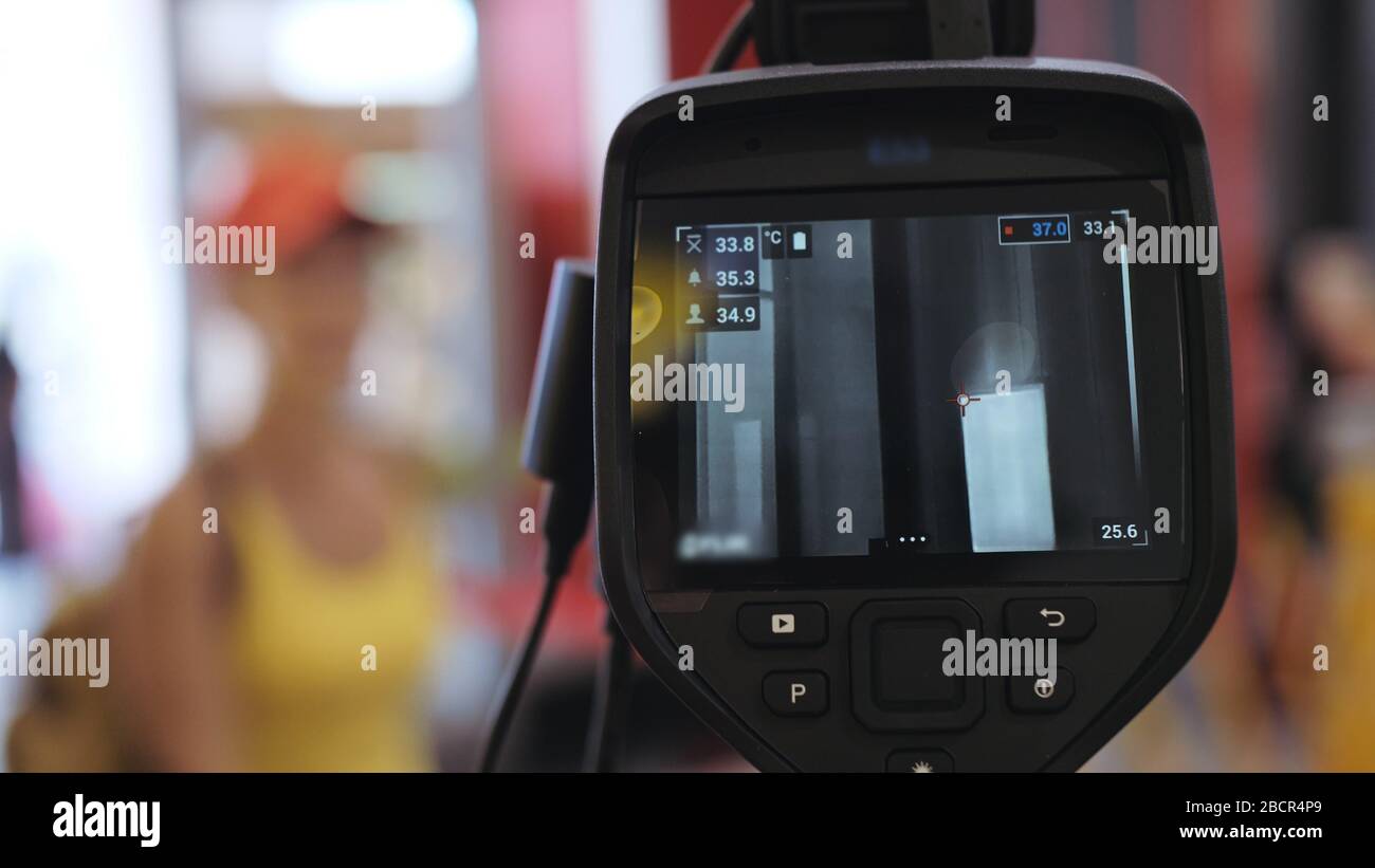 Temperature check at a supermarket, grocery store with a thermal ...