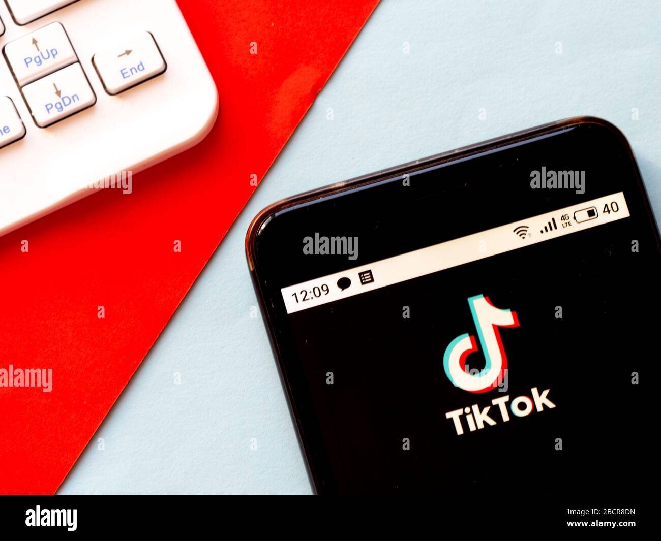 In this photo illustration a TikTalk logo seen displayed on a ...