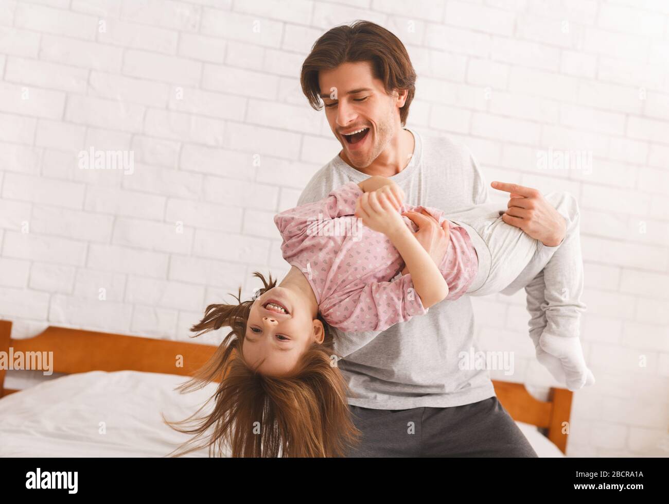 Young father playing with his preschool daughter at home Stock Photo ...