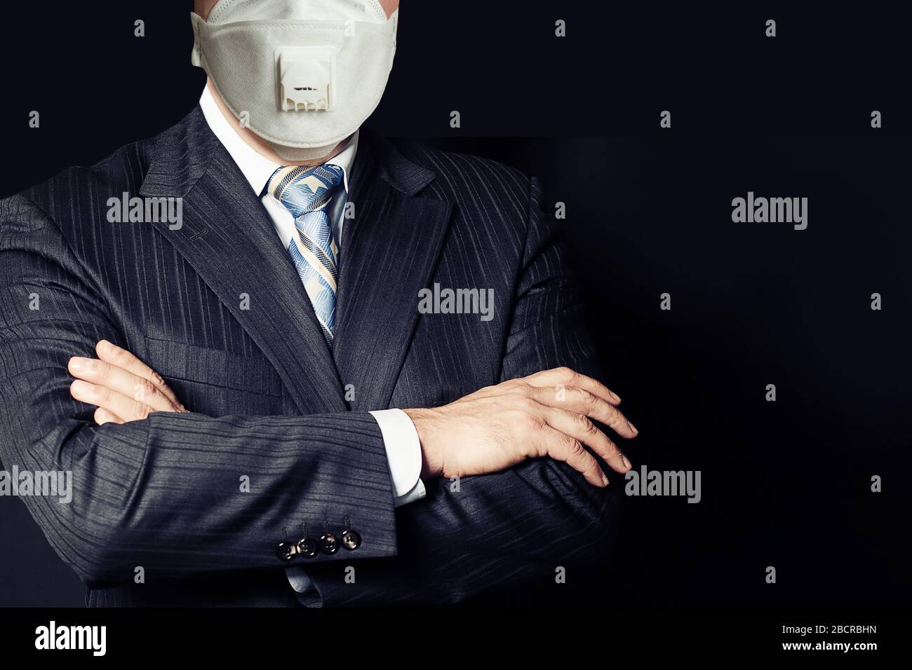 Confident man in medical face mask on black background Stock Photo - Alamy