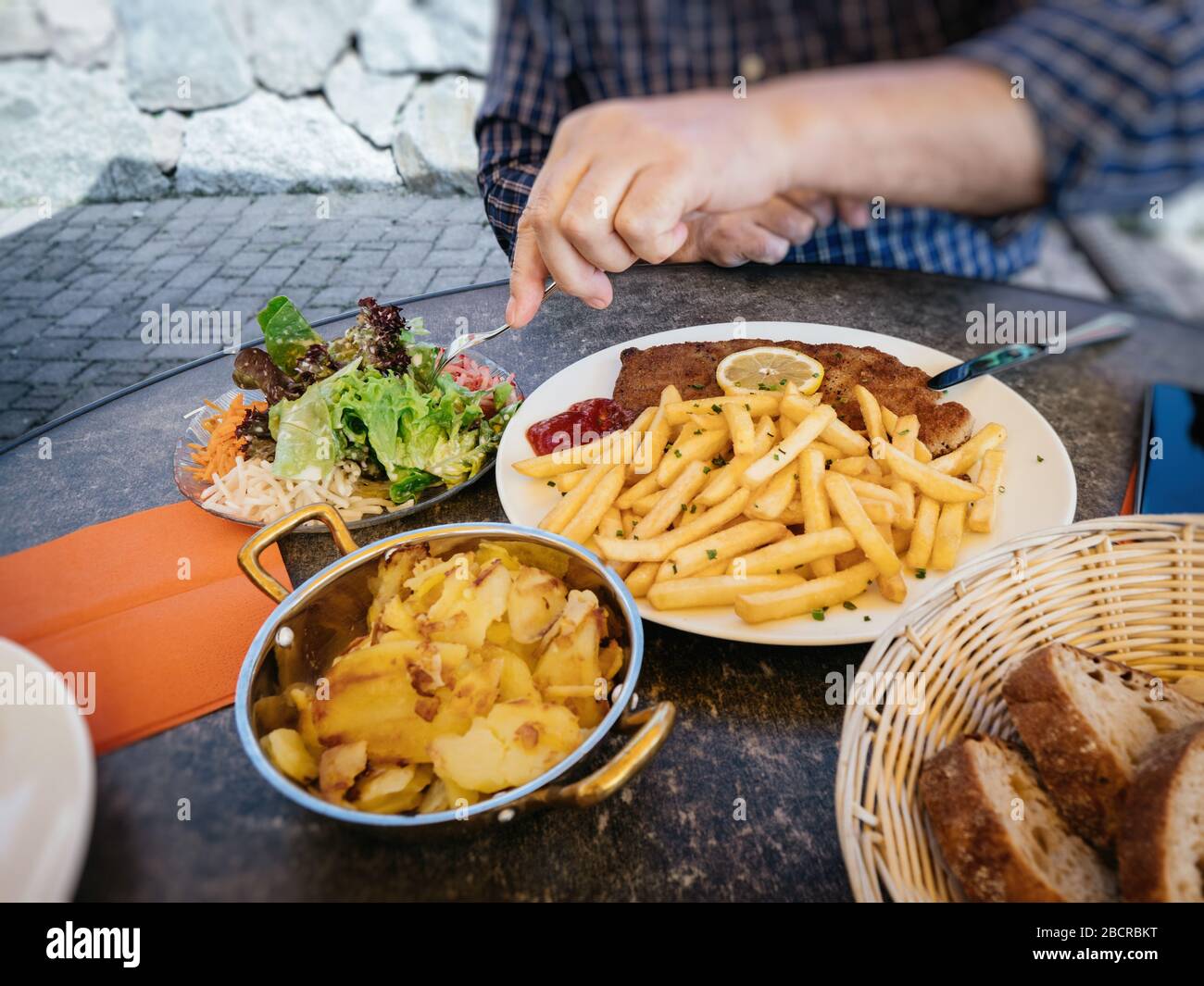 Chicken schnitzel with people hi-res stock photography and images - Alamy