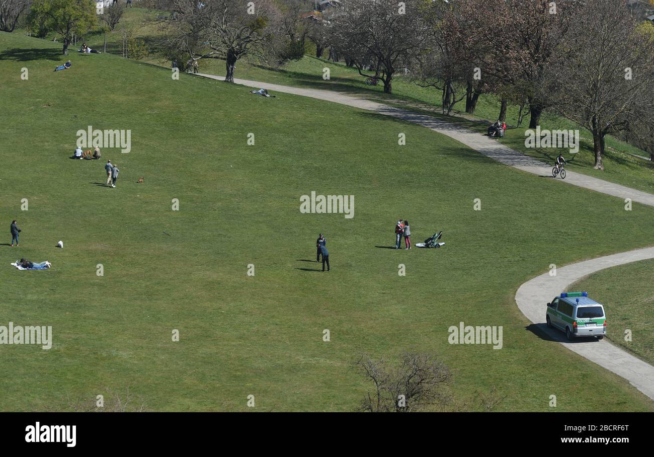 05 April 2020, Bavaria, Munich: A police bus drives in the Olympic Park ...