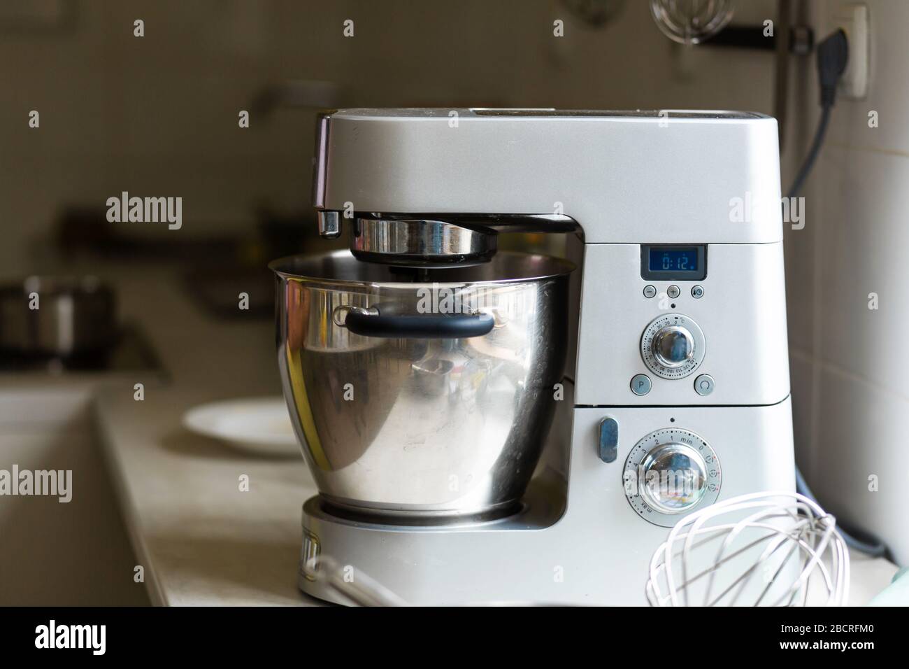 professional pastry chef preparing a dessert. Adds ingredients and ...