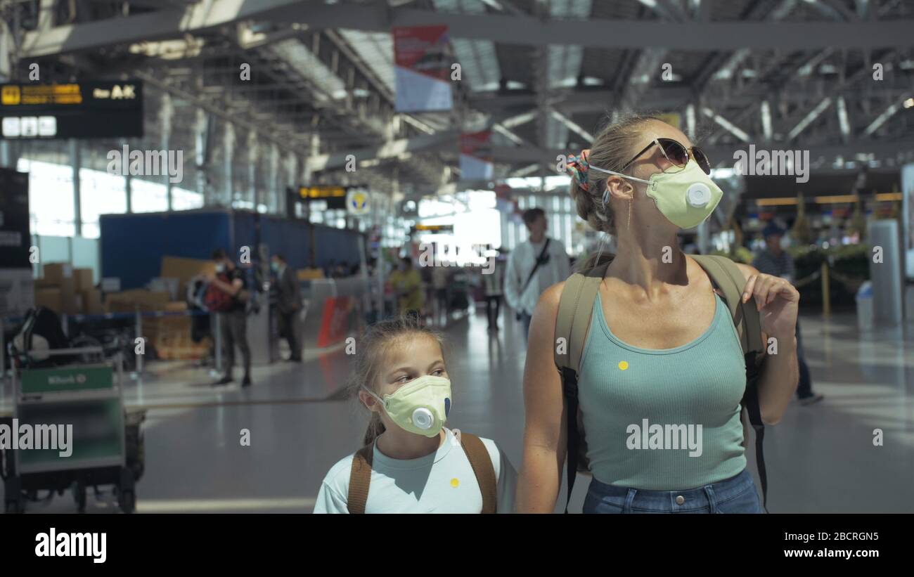 Woman and child baby tourist caucasian at airport with wearing ...