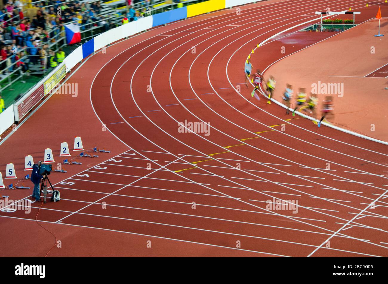 Group of professional athletes on the long distance track during ...
