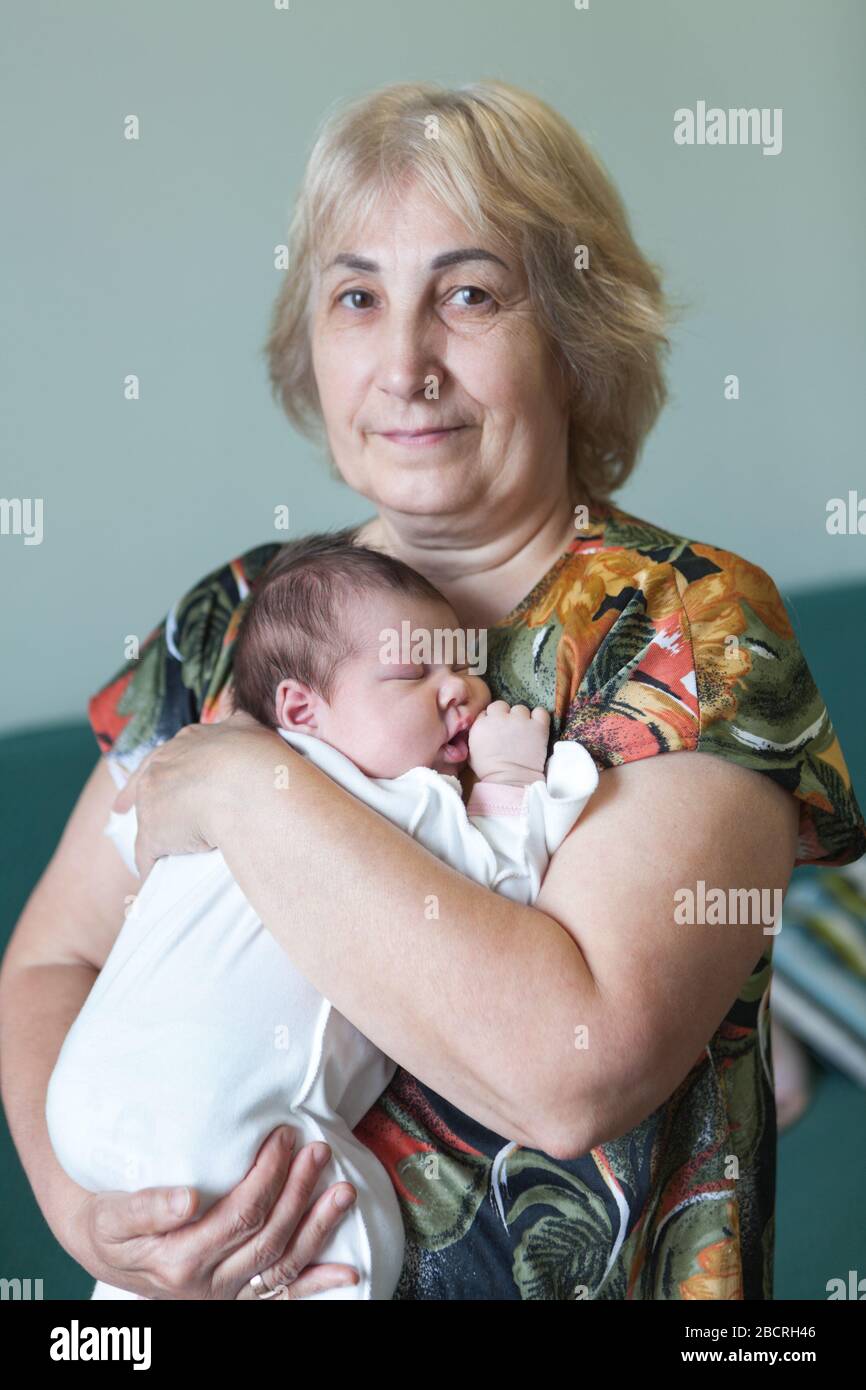 Baby hugging grandma hi-res stock photography and images - Alamy