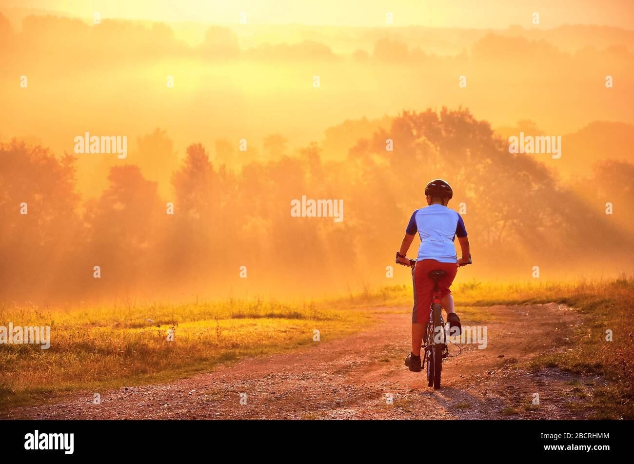 Young man on bicycle hi-res stock photography and images - Alamy