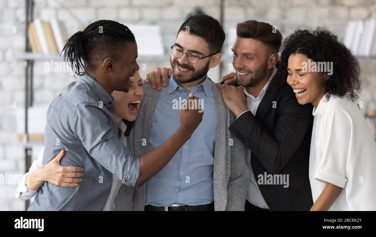 Smiling team laughing work hi-res stock photography and images - Alamy