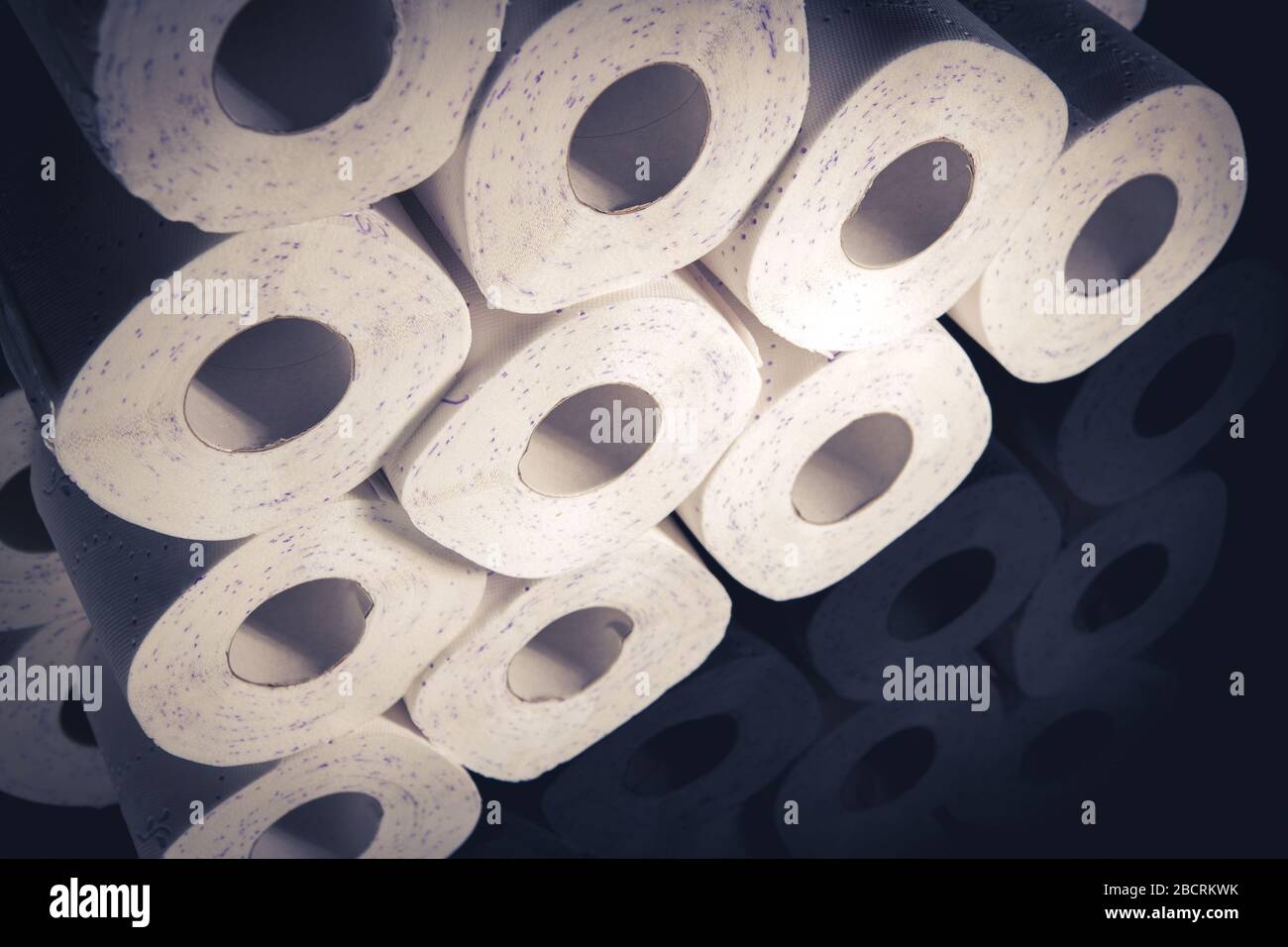 Pile of Toilet Paper on Dark Glassy Table. Rolls of Tissue Paper ...