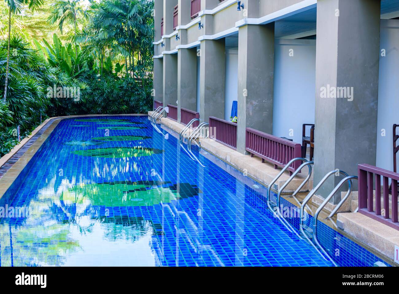 Swimming pool in a luxury hotel with private balconies with direct ...