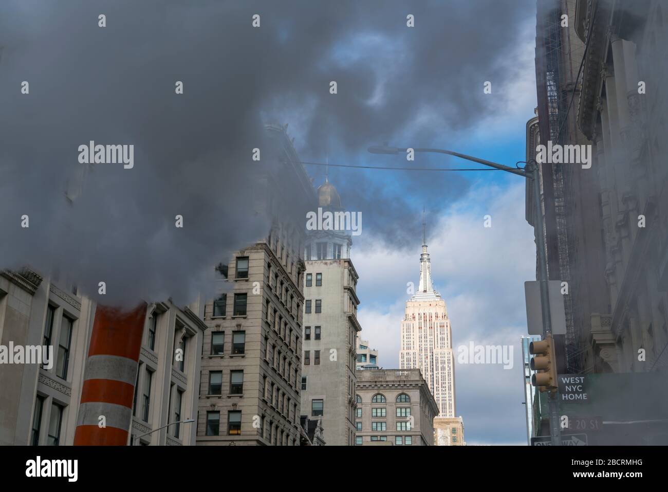 The steam rises and drifts among the Midtown Manhattan Fifth Avenue ...