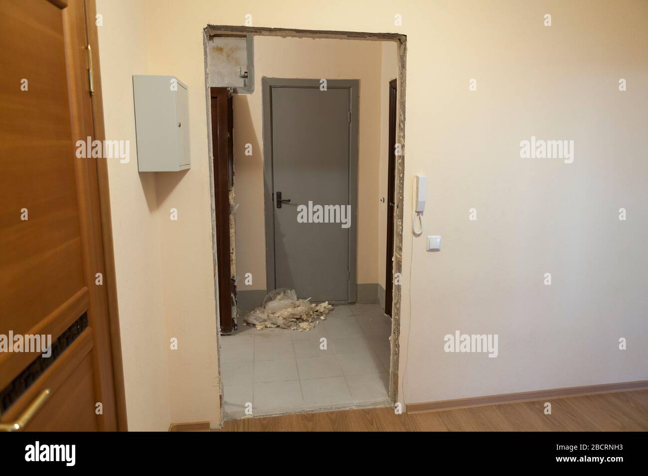 Empty aperture of a door in wall of domestic hall, preparations for new ...