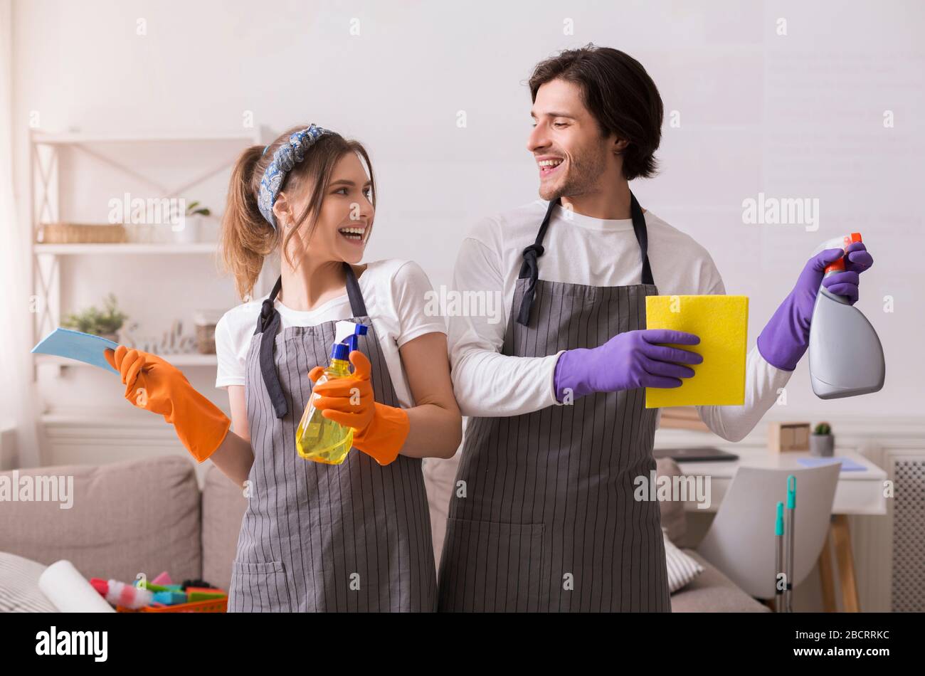 Spring Cleaning. Married Couple Having Fun While Tidying Apartment ...