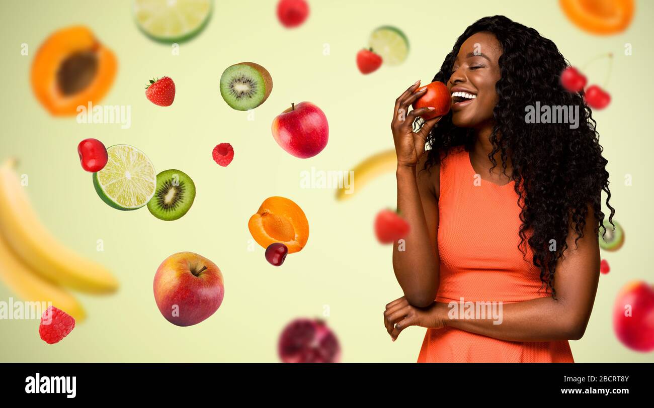 Healthy diet. Beautiful African American woman eating apple, collage ...