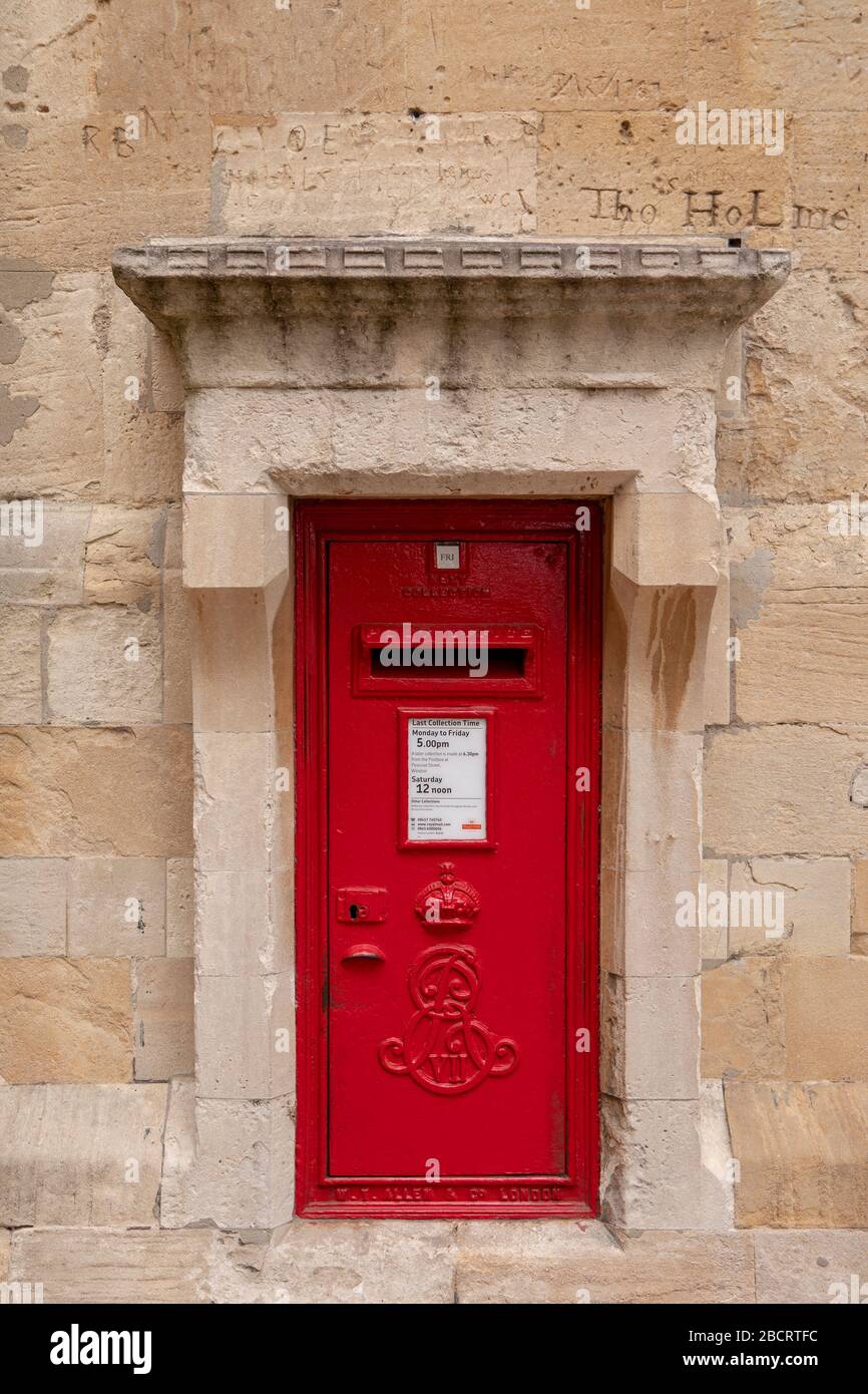 King Edward VII Postbox set in a sandstone wall. Ornate surround with ...