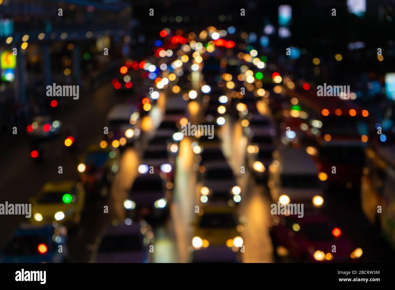 Blurred footage. Traffic jam on a wide street. Blurry brake lights ...