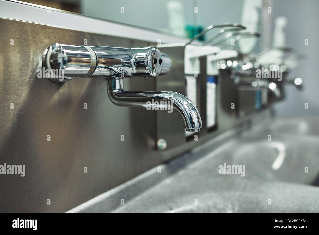 Hand wash room in the hospital. Modern preoperative room for ...