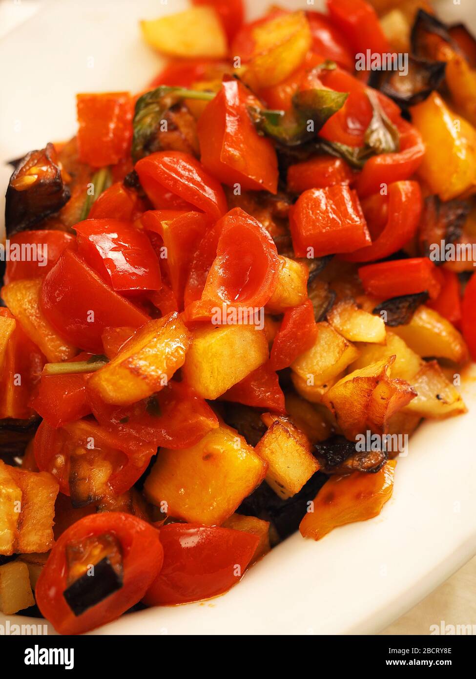 Traditional calabrian recipe Ciambotta, potatoes, tomatoes, peppers and ...