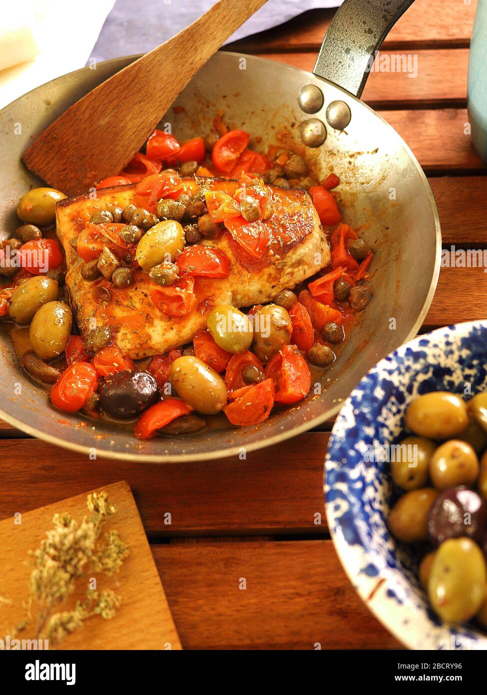 Pesce Spada alla Ghiotta, traditional swordfish calabrian recipe with capers, olives, tomato ...