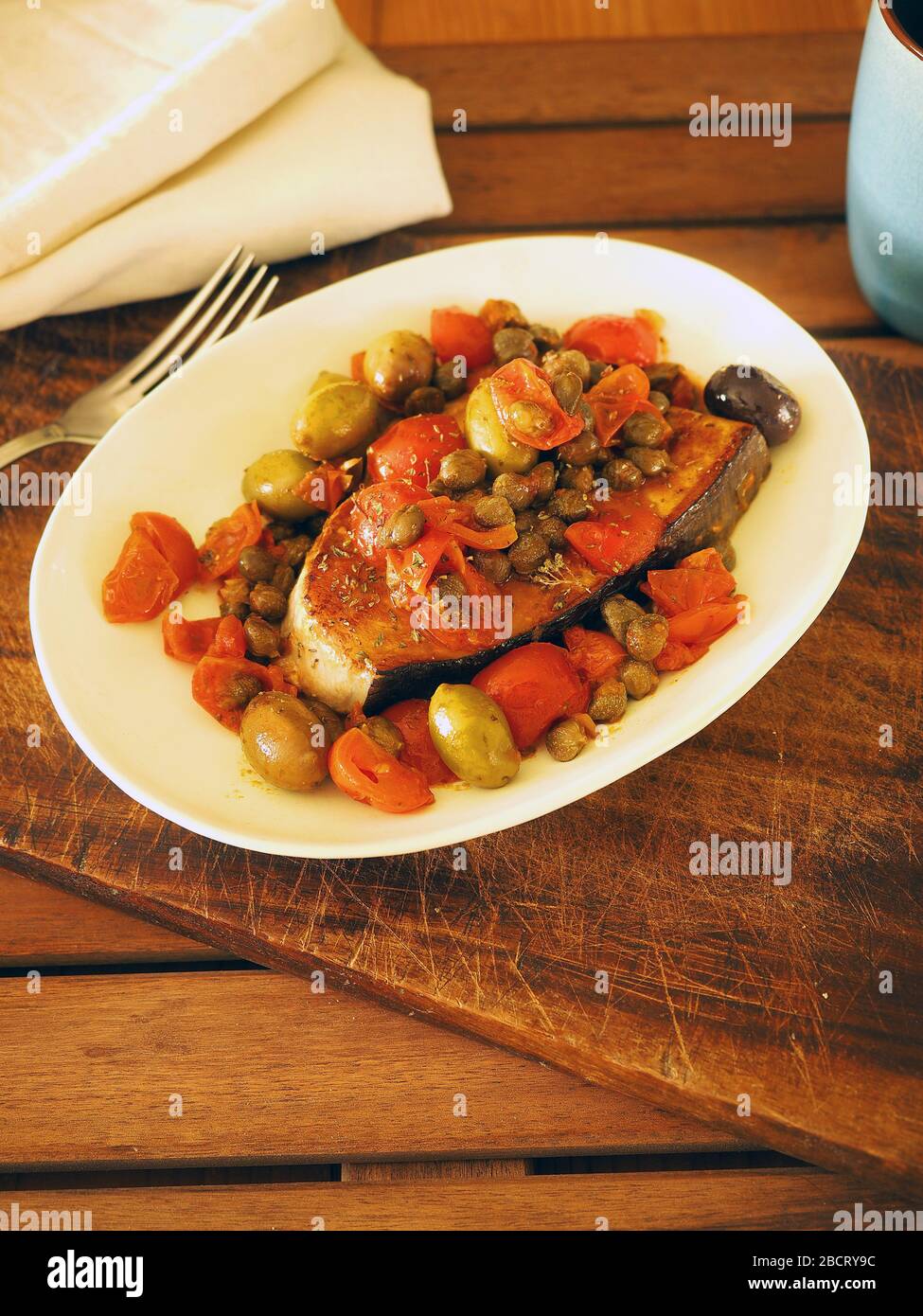 Pesce Spada alla Ghiotta, traditional swordfish calabrian recipe with capers, olives, tomato ...