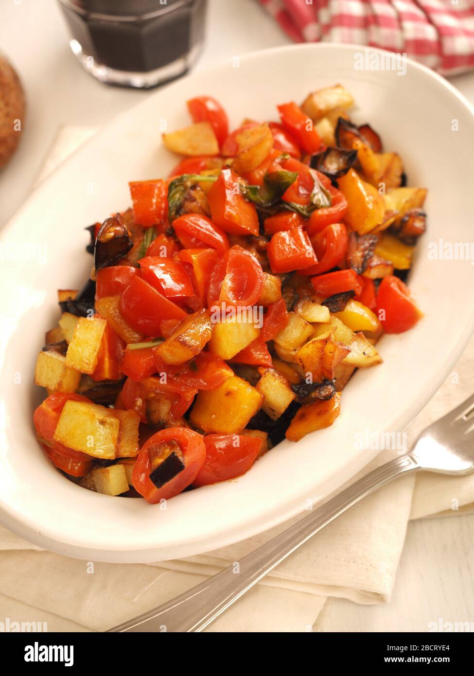 Traditional calabrian recipe Ciambotta, potatoes, tomatoes, peppers and ...