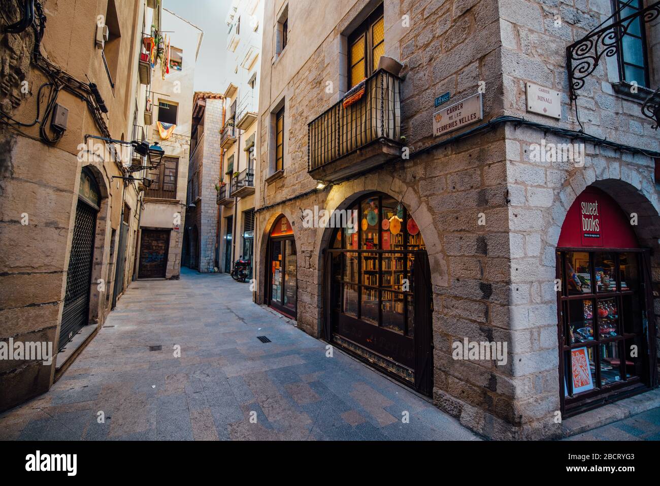 Medieval streets of Girona. Medieval alley with stone walls in Girona ...