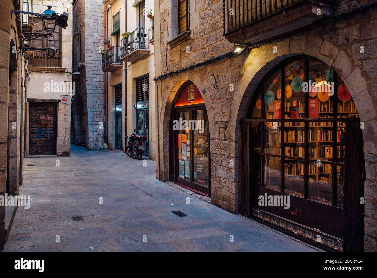 Medieval streets of Girona. Medieval alley with stone walls in Girona ...