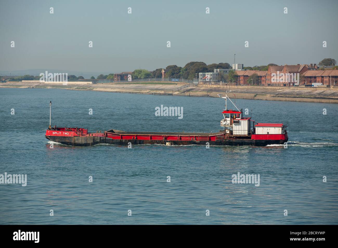 Split 2 barge leaving Portsmouth harbour. Dredging vessel conveying mud ...