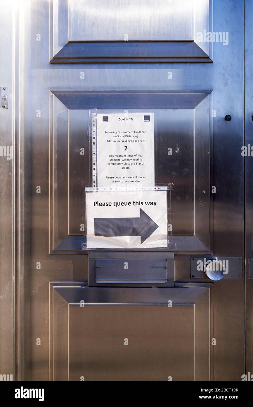 Covid-19 Coronavirus social distancing advice poster taped to a ...