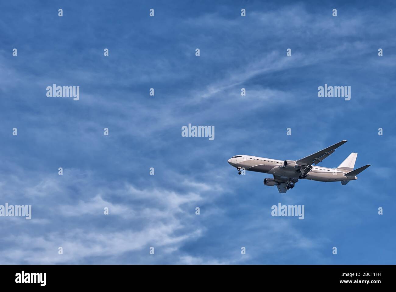 The airplane flying in the sky a close up the bottom view Stock Photo ...