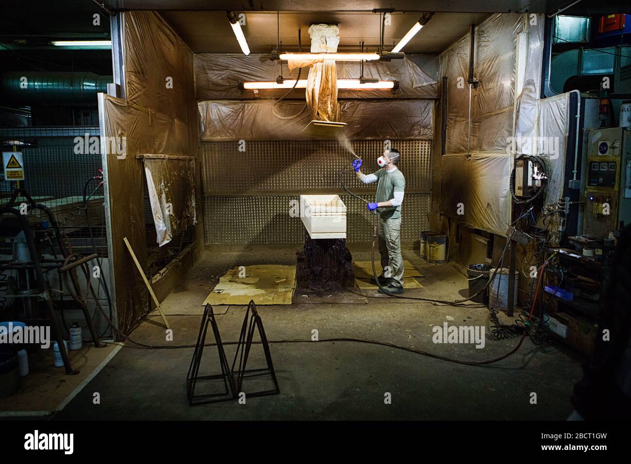 A coffin maker busy producing coffins at a factory.The Eurocoffin ...