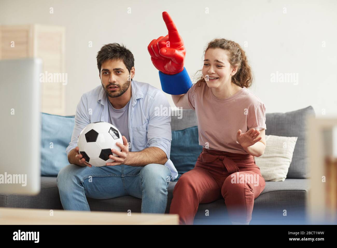 Watching football female fan cheering hi-res stock photography and ...