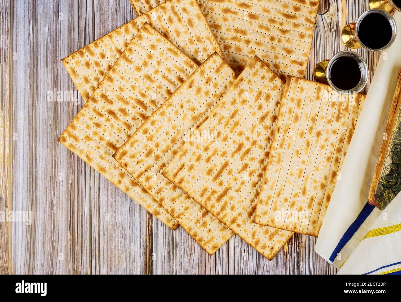 Passover celebration with matzo unleavened bread kiddush cup of wine ...