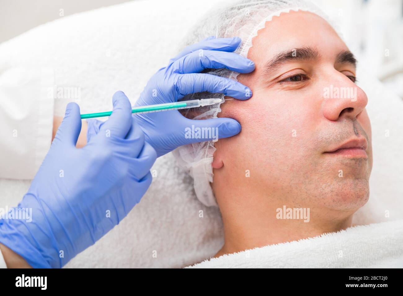 Closeup man botox injection hi-res stock photography and images - Alamy