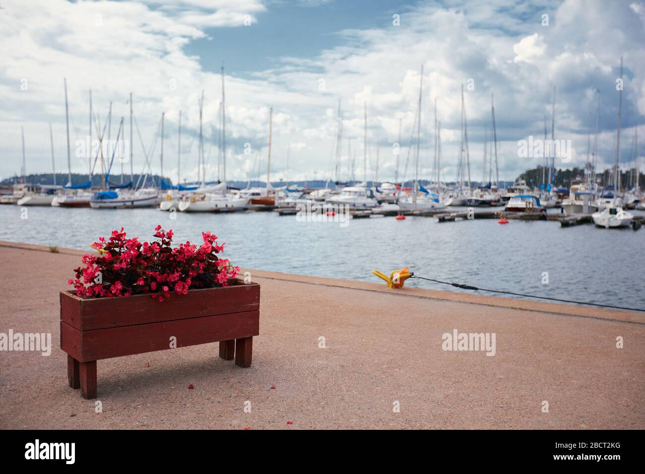 stone quay with yacht marina on background Stock Photo - Alamy
