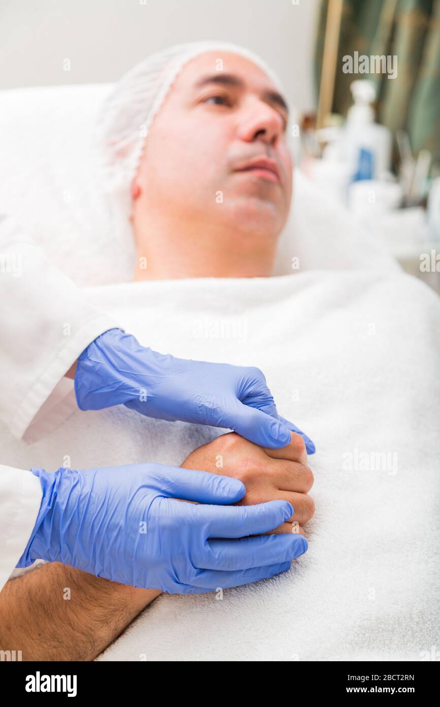 Woman squeezing man hand hi-res stock photography and images - Alamy