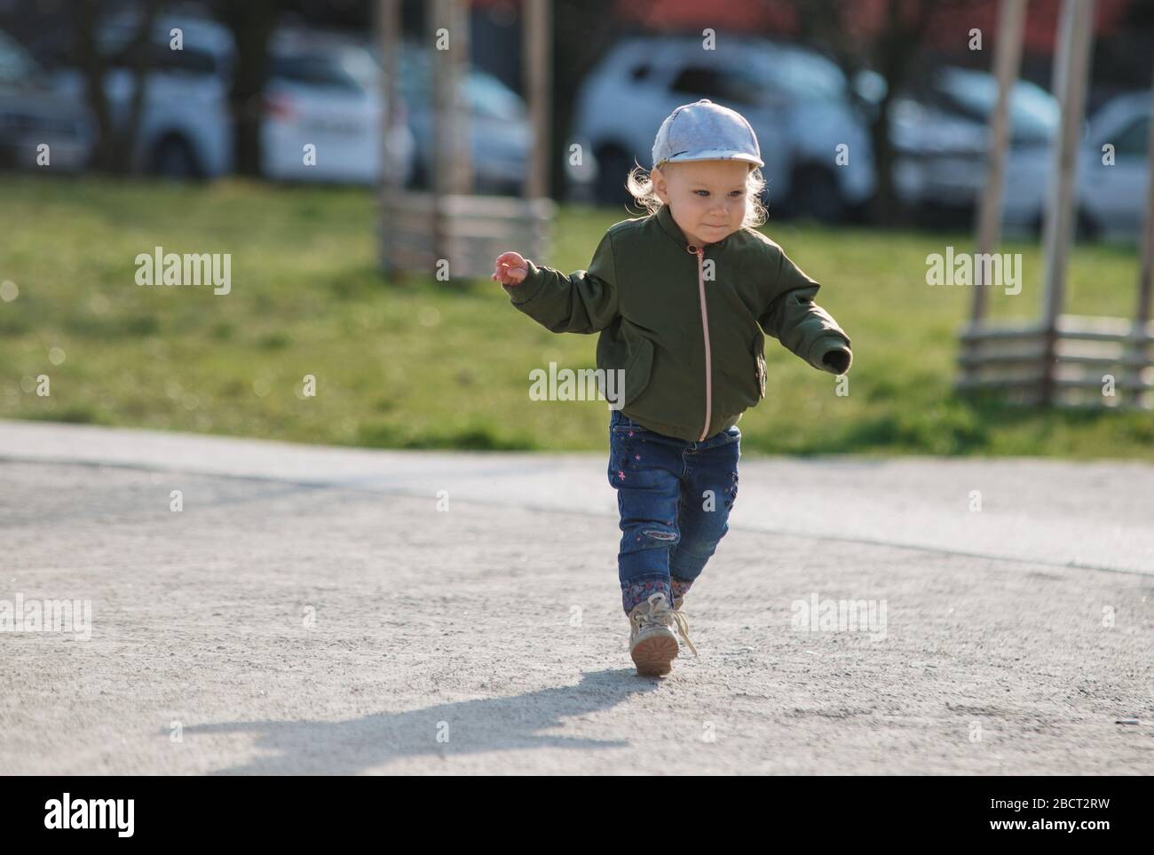 child girl running in the playground Stock Photo - Alamy