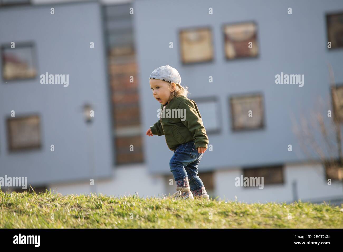 child girl running in the playground Stock Photo - Alamy