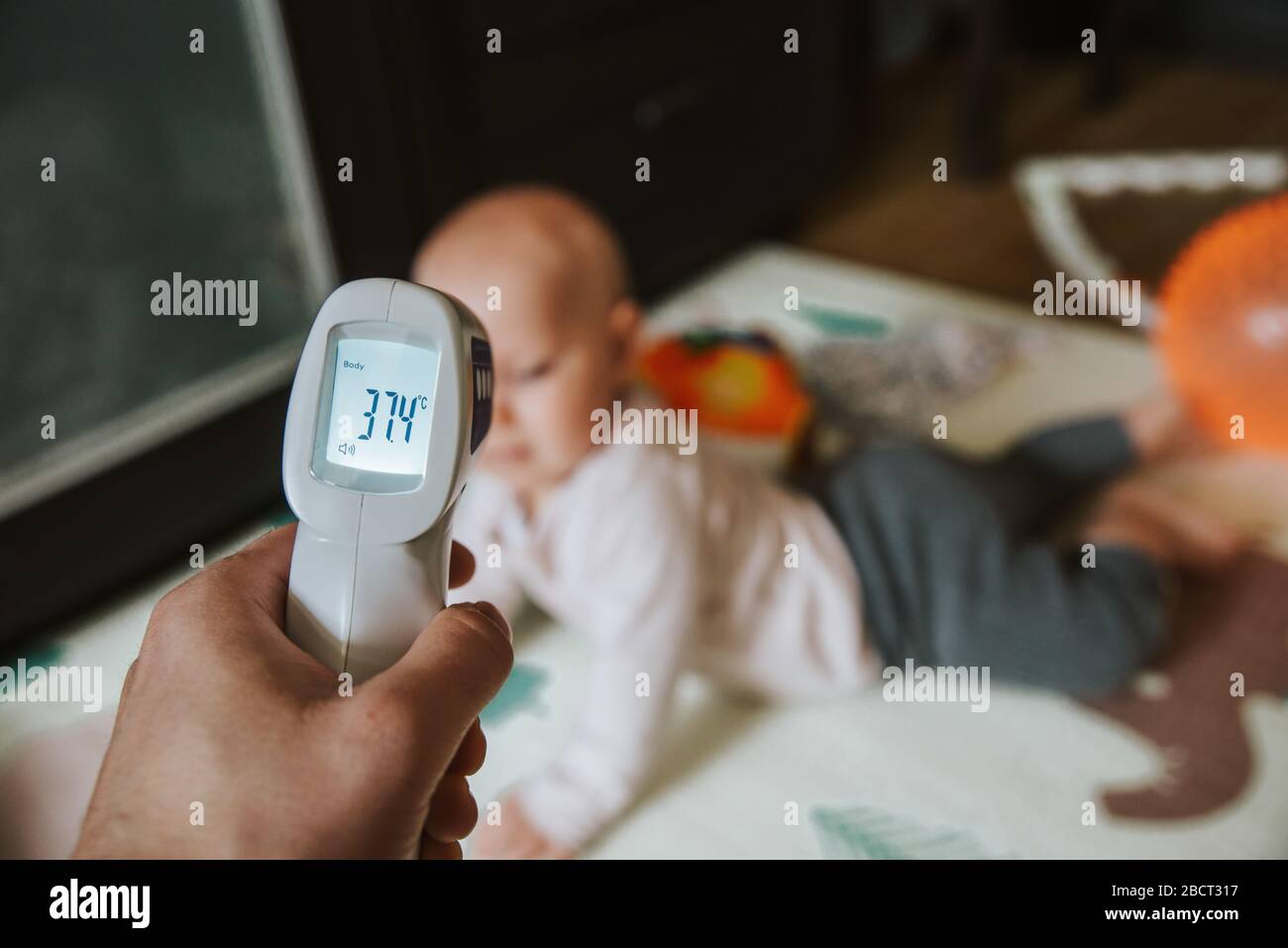 temperature measurement in a child, illness, 37.4 Stock Photo - Alamy