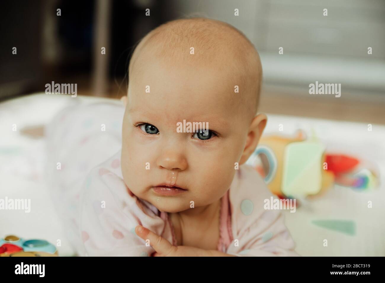 the first cold in a young child, crying, glass eyes, illness Stock ...