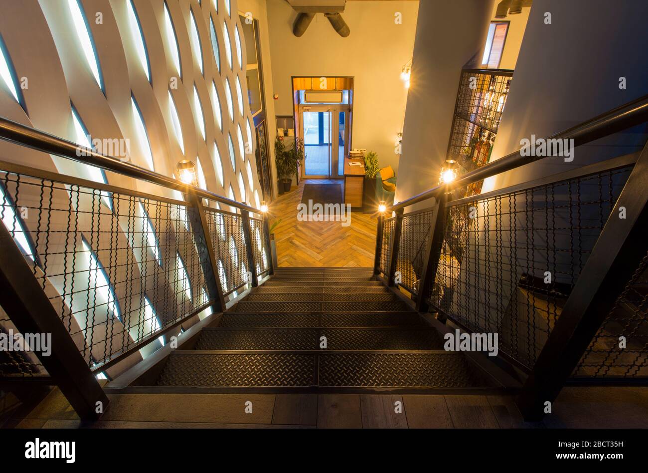 Stairs in modern restaurant to the first floor, creative wall Stock ...